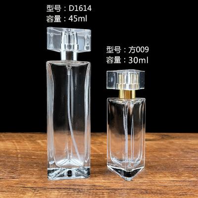 China Triangular Spot Perfume Glass Spray Bottle 30ml Transparent Empty 50ml for sale