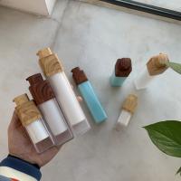 China Plastic AS White 15ml 30ml 50ml Lotion Pump Bottle With Wooden  Cap for sale