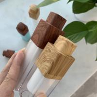 China Plastic AS White 15ml 30ml 50ml Lotion Pump Bottle With Wooden  Cap for sale