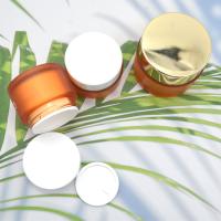 China Gold Amber Cream Frosted Plastic Jars With Aluminium Anodized Caps for sale