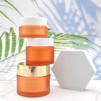China Gold Amber Cream Frosted Plastic Jars With Aluminium Anodized Caps for sale