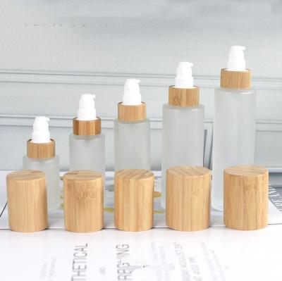 China Glass Frosted Bamboo Lotion Pump Bottle 30ml 50ml 60ml for sale