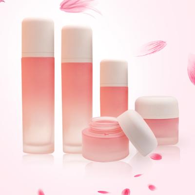 China Frosted Gradient Pink Color Glass Cosmetic Lotion Pump Bottle for sale
