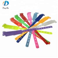China Custom Neon Color PVC Wristband 250mm x 25mm Waterproof Plastic Bracelet for Hotel Identification for sale