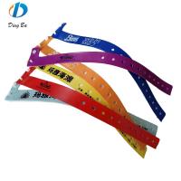 China Custom Logo Orange PVC Wristbands 250x25mm for Events Festival Disposable Waterproof for sale