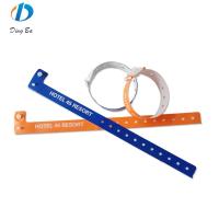 China Custom Logo Orange PVC Wristbands 250x25mm for Events Festival Disposable Waterproof for sale