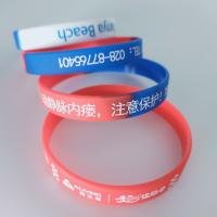 China Custom Silicone Wristband 202x12x2mm Glow in Dark Waterproof Orange Bracelet for sale