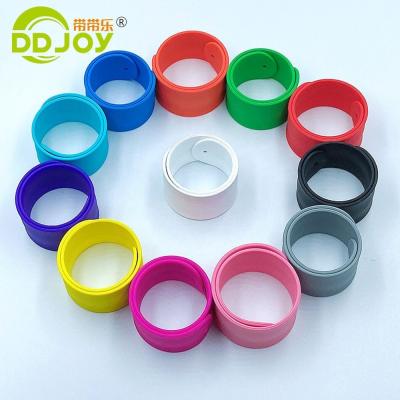China Custom Silicone Snap Slap Bracelet 215x25x2mm Bulk Personalized Wristband for sale