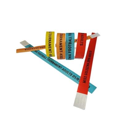 China Custom Logo Tyvek Wristbands 250x25mm Waterproof Adhesive Paper Wristband for Events for sale