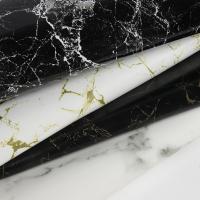 China 0.7mm Waterproof PU Synthetic Leather with Matte Marble Pattern for Cosmetic Bags and Table Mats for sale