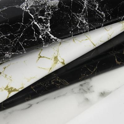 China 0.7mm Waterproof PU Synthetic Leather with Matte Marble Pattern for Cosmetic Bags and Table Mats for sale