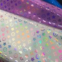 China Laser Colorful Pentagon Flower PU Leather Material 0.8-1.2mm Thickness for Handbags and Clothing for sale