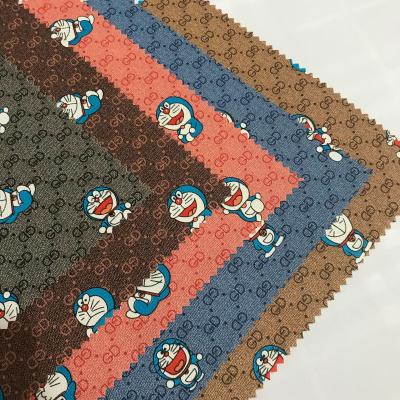 China Printed Cartoon GD Letter Jingle Cat PVC Faux Leather Fabric 1.0mm for Bags Phone Cases Packaging for sale