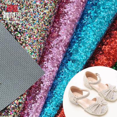 China Coarse Glitter PVC Synthetic Leather Material 0.8mm Thickness 140cm Width for Shoes Bags Packaging for sale