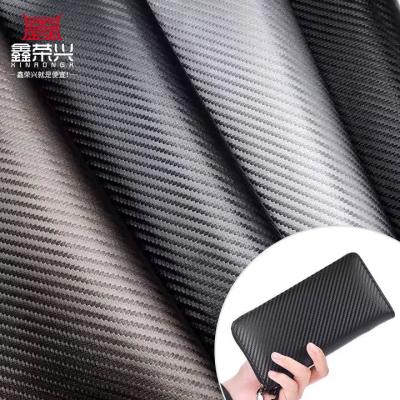 China 1.0mm Thick Carbon Fiber PU Synthetic Leather Material - 137-140cm Width for Bags, Wallets & Automotive Applications for sale