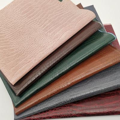 China PVC Crocodile Grain Artificial Synthetic Leather Fabric 0.55mm 140cm for Wallet Box Shoes Notebook for sale