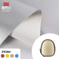 China Elastic PU Carbon Fiber Straw Mat Synthetic Leather 0.5mm 140cm for Bags Clothing for sale