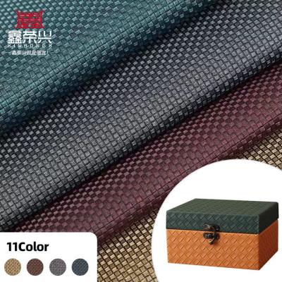 China PVC Leather Fabric Shiny Embossed Weave Pattern 0.6mm 140cm Width for Wallet Box Shoes Notebook for sale