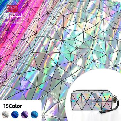 China PU Laser Mirror Triangulation Synthetic Leather - 0.8mm Thickness, 137-140cm Width for Luggage & Bags for sale