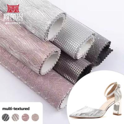 China Elastic PU Embossed Glitter Faux Leather Fabric 0.5mm 140cm for Shoes Bags Crafts for sale