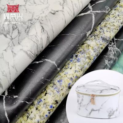 China Marbling Grain Printed PVC Leather 0.75mm 140cm Double Brushed Backing 20 Colors for Bags Wallets for sale