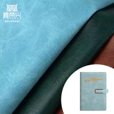 China PVC Printed Kraft Grain Synthetic Leather Faux Leather 0.5mm 140cm for Bag Notebook Table Mat for sale