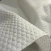 China Spunlace Nonwoven Fabric 28-200 GSM for Wet Wipes | Cross & Parallel Embossed Patterns | Eco-Friendly Material for sale