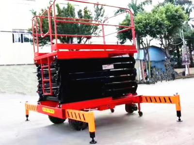 China Self Propelled Electric Scissor Lift 12m Platform Hydraulic Motor Driving 500kg Capacity for sale