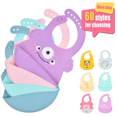 China Cartoon Silicone Feeding Bib Purple Rubber Bib With Pocket Waterproof for sale