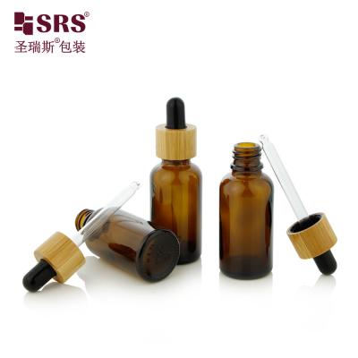 China 1 oz Empty Amber Cosmetic Essential Oil Bamboo Shoulder 30ml  Glass Dropper Bottle for sale