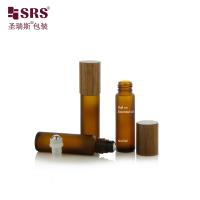China BLPM-10ML Amber Frosted Glass Roller Steel Ball Essential Oil Bottle With Wooden Cap for sale