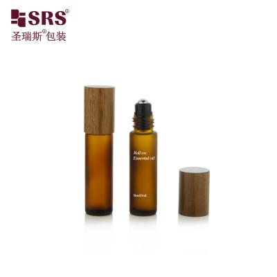 China BLPM-10ML Amber Frosted Glass Roller Steel Ball Essential Oil Bottle With Wooden Cap for sale