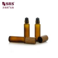 China BLPM-10ML Amber Frosted Glass Roller Steel Ball Essential Oil Bottle With Wooden Cap for sale