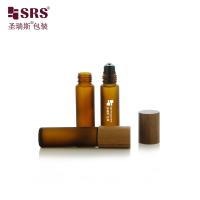 China BLPM-10ML Amber Frosted Glass Roller Steel Ball Essential Oil Bottle With Wooden Cap for sale