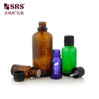 China UV Protection Amber Green Glass Essential Oil Bottle Tamper Evident Screw Cap Custom Logo Cosmetic Packing for sale
