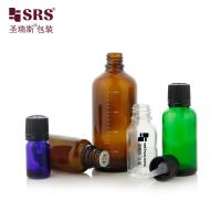 China UV Protection Amber Green Glass Essential Oil Bottle Tamper Evident Screw Cap Custom Logo Cosmetic Packing for sale