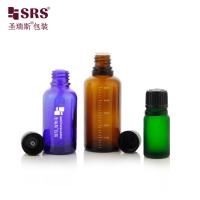 China SRS Custom Logo Empty Round Glass Essential Oil Bottle Tamper Evident Cap Multiple Orifice Sizes for sale