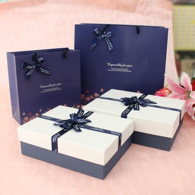China Custom Logo White Kraft Paper Gift Bag with Rope Handle 3 Sizes S M L Recyclable for sale