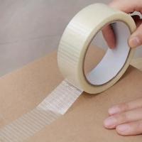 China Fabric Glue Reinforcement Cross Filament Tape With High Temperature Hot Melt Adhesive for sale