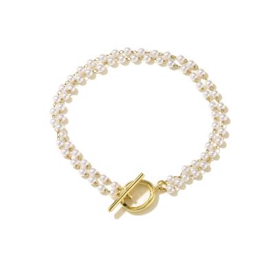 China OEM 18k Gold Plated Imitation Pearl OT Button Charm Bracelet Women Jewelry 7.5 Inch for sale