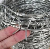 China Hot Dipped Galvanized Barbed Wire Coil 100-300m Length with 1.4-2.6mm Wire Gauge for Security Fencing for sale