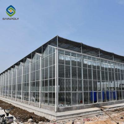 China Galvanized Multi Span 120km/H Commercial Glass Greenhouse for sale