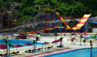 China 13m Platform Height U-Turn Water Slide with 480 Riders/Hour Capacity and 2-Person Raft for sale
