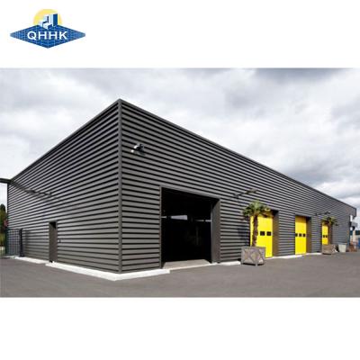 China Spacious Large Outdoor Commercial Steel Structure Garage With Rolling Shutter Door for sale