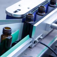 China Npack Electric Driven Automatic Round Bottle Labeling Machine For Plastic Pet Glass Bottles for sale