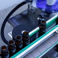 China Npack Electric Driven Automatic Round Bottle Labeling Machine For Plastic Pet Glass Bottles for sale