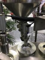 China Automatic Rotary Tomato Chilli Sauce Cup Filling And Sealing Machine for sale