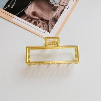 China Large Gold Alloy Hair Claw Clip 9cm Hollow Shark Design Simple Elegant Women Accessories for sale