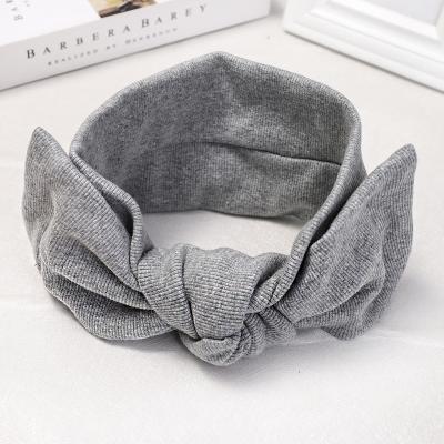 China Pure Color Knitted Bow Hair Band for Women 11cm Wide Elastic Non Slip Winter for sale