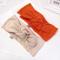 China Pure Color Knitted Bow Hair Band for Women 11cm Wide Elastic Non Slip Winter for sale